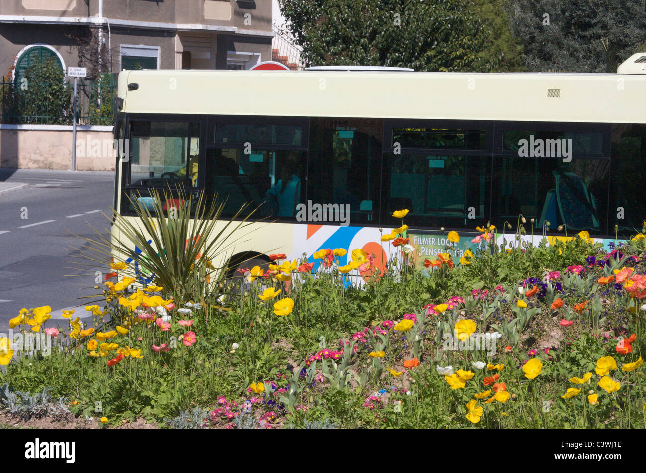 bus roundabout circular junction with flowers Stock Photo - Alamy