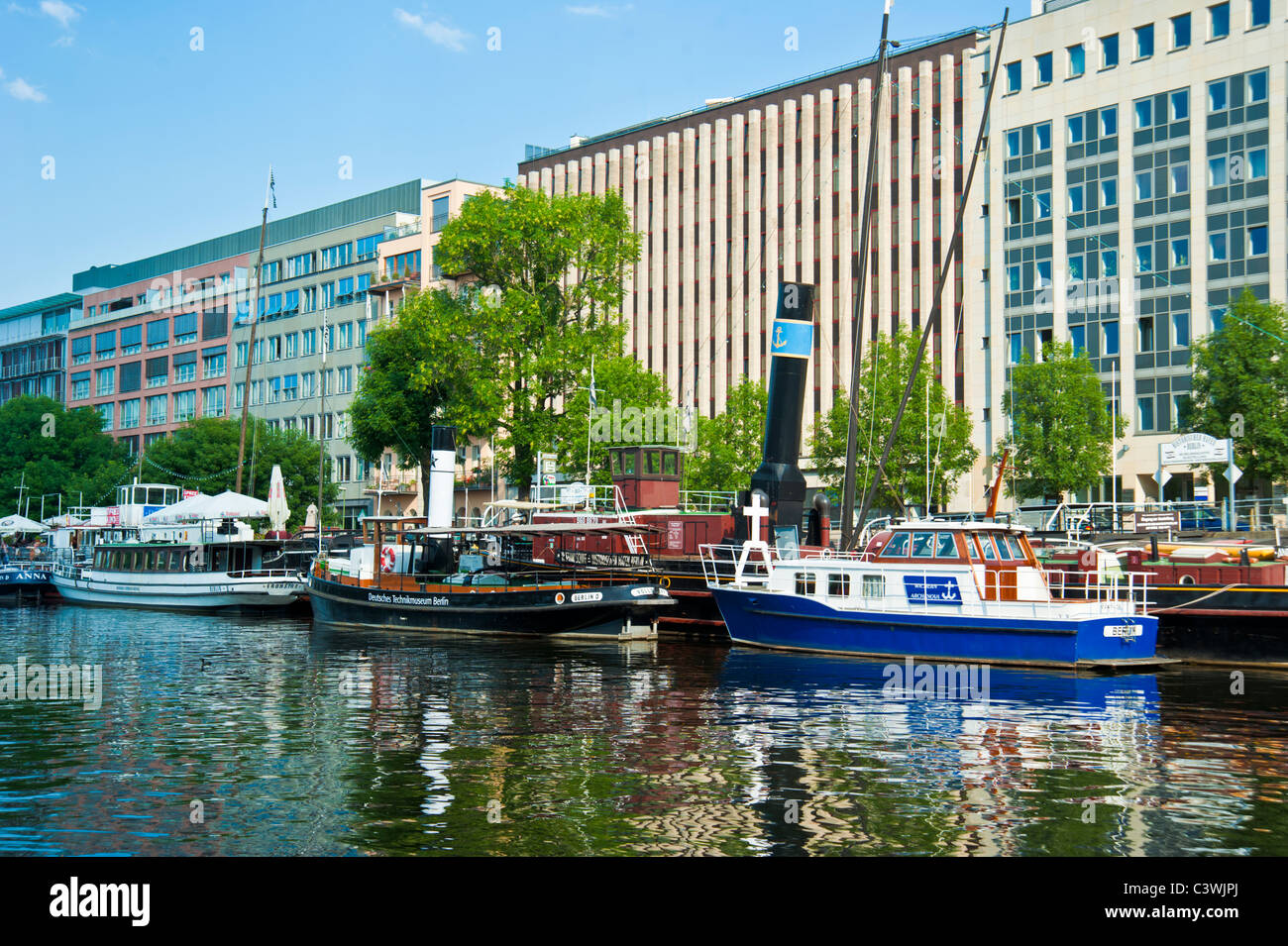 Museum ships moored in front of facades at historic port, harbor at ...