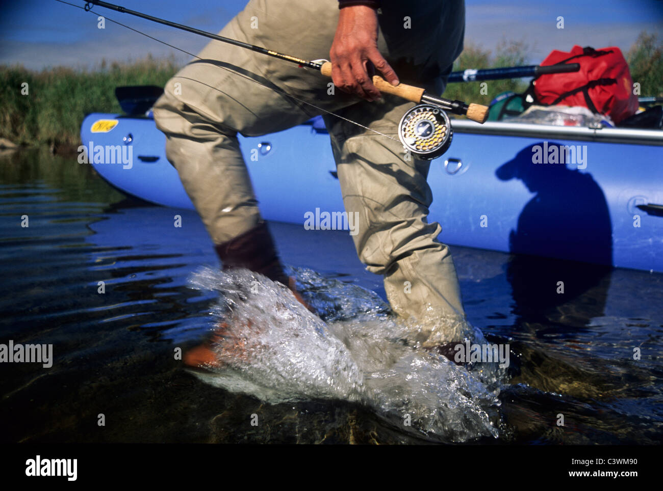 Man fly fishing Stock Photo - Alamy