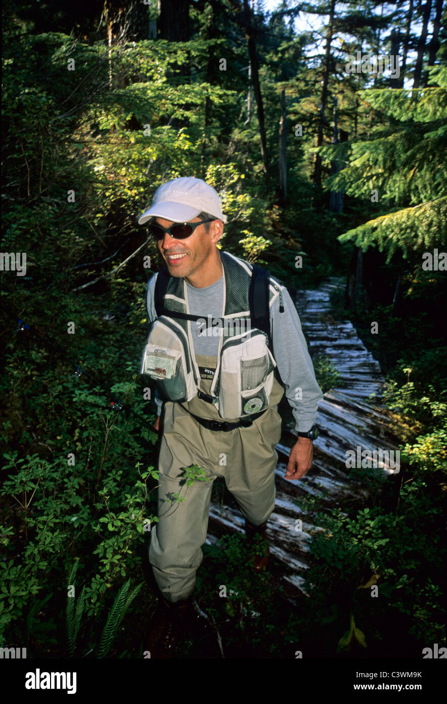 Man fly fishing Stock Photo - Alamy