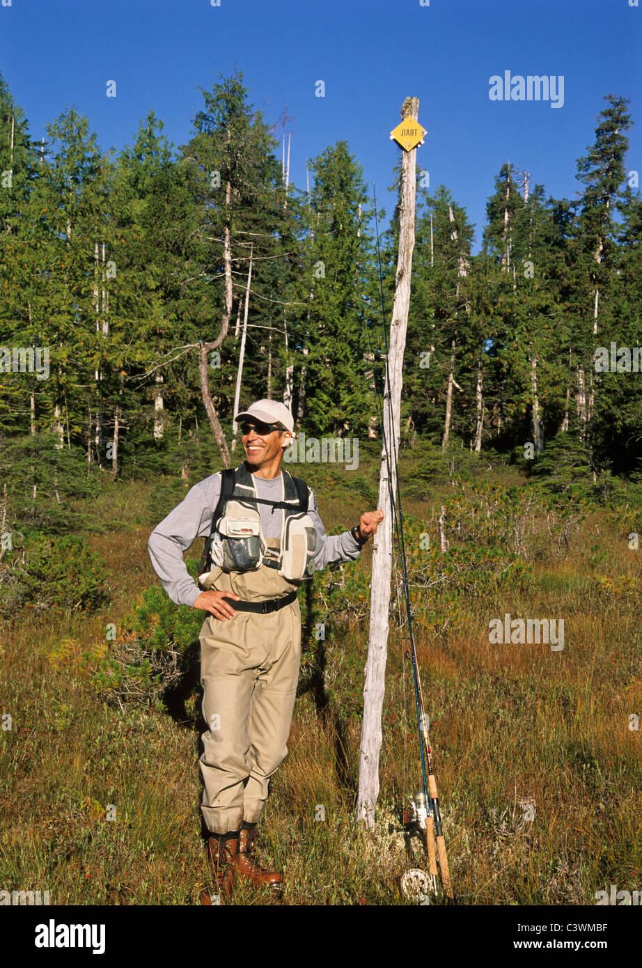 Man fly fishing Stock Photo - Alamy