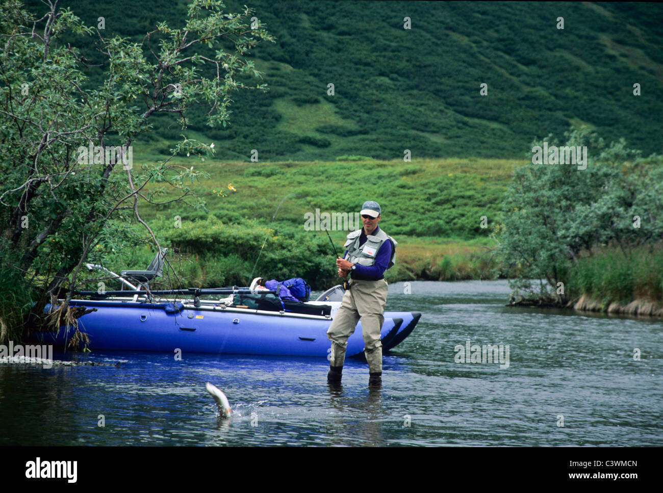 Man fly fishing Stock Photo - Alamy