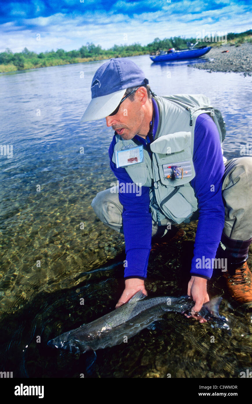 Man fly fishing Stock Photo - Alamy