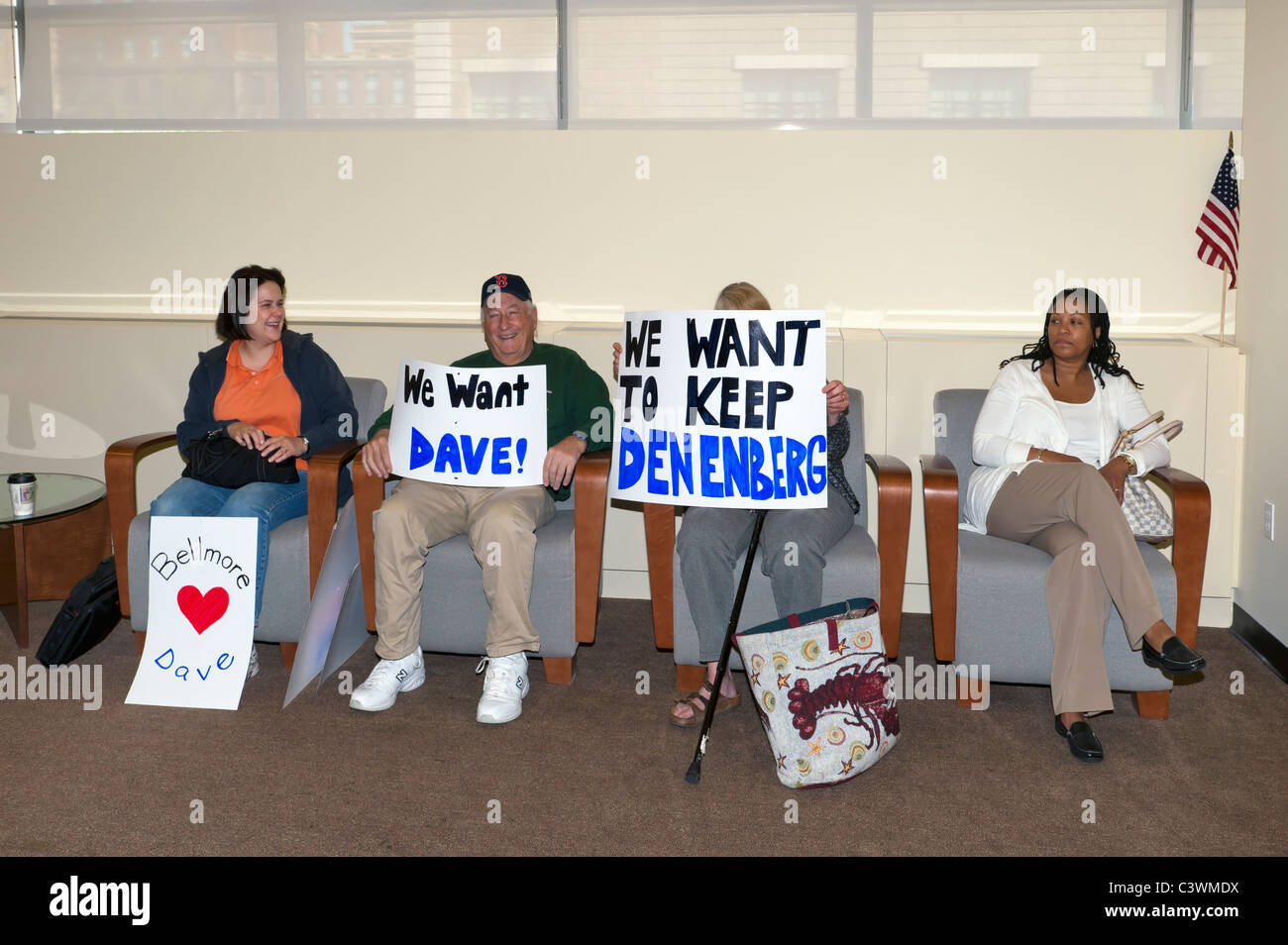 In Nassau County Legislative Building waiting room, people with posters ...