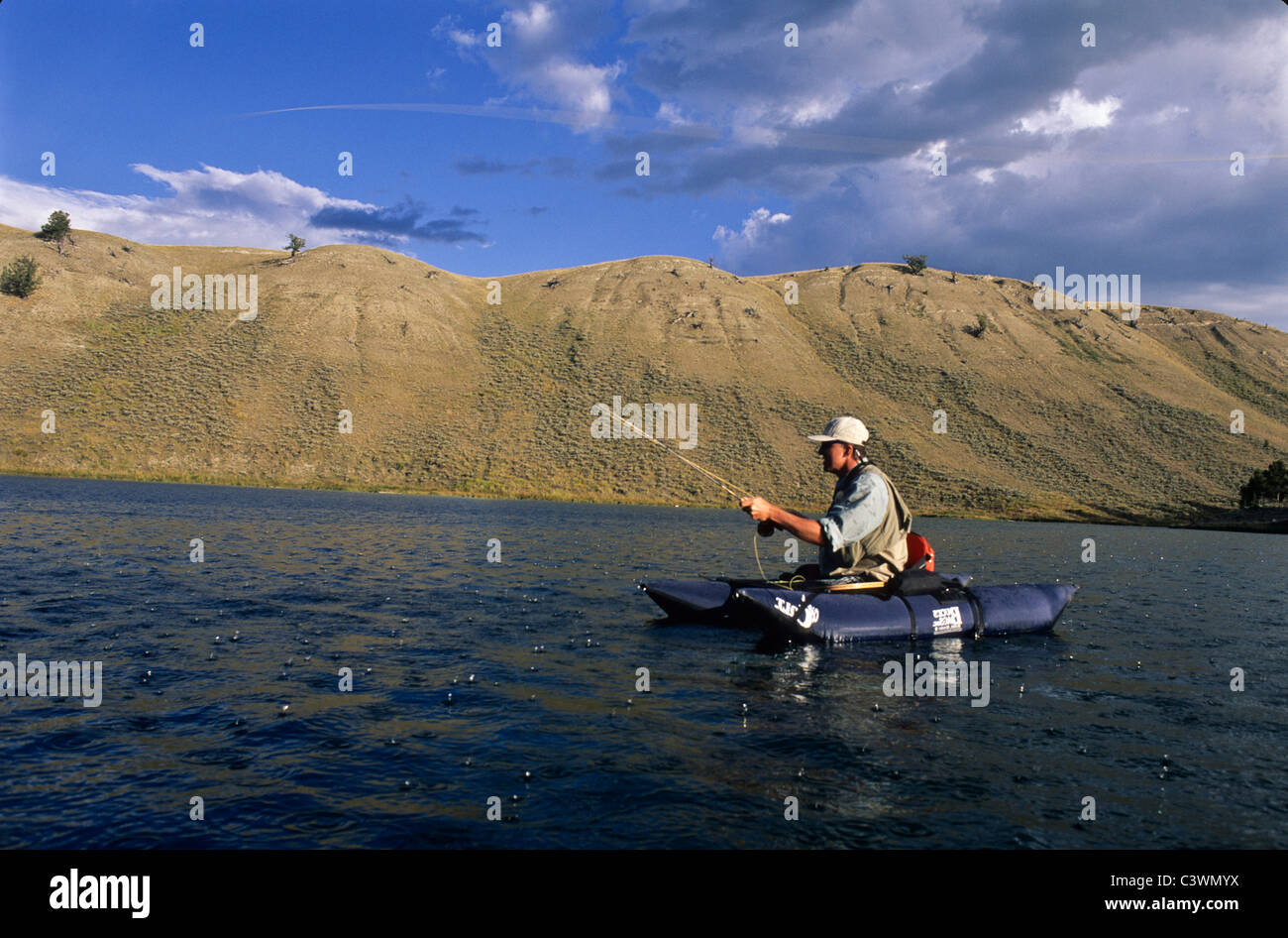 Man fly fishing Stock Photo - Alamy