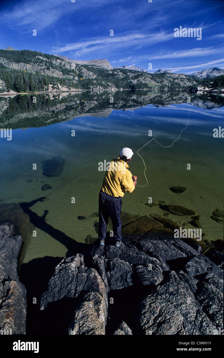 Man fly fishing Stock Photo - Alamy
