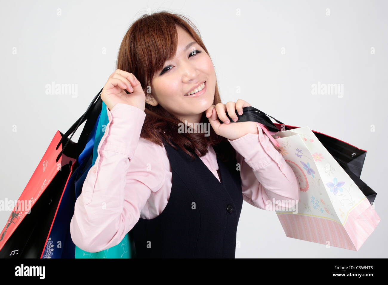 Office lady takes shopping bags Stock Photo - Alamy