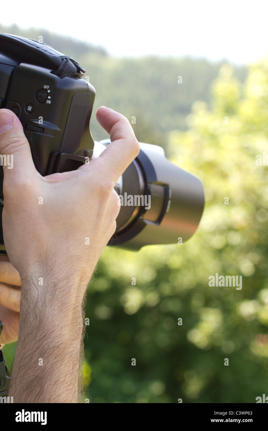 An SLR camera taking a photo outside Stock Photo - Alamy