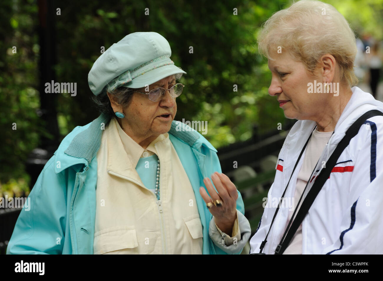 Elderly women talking in a New York City park Stock Photo - Alamy