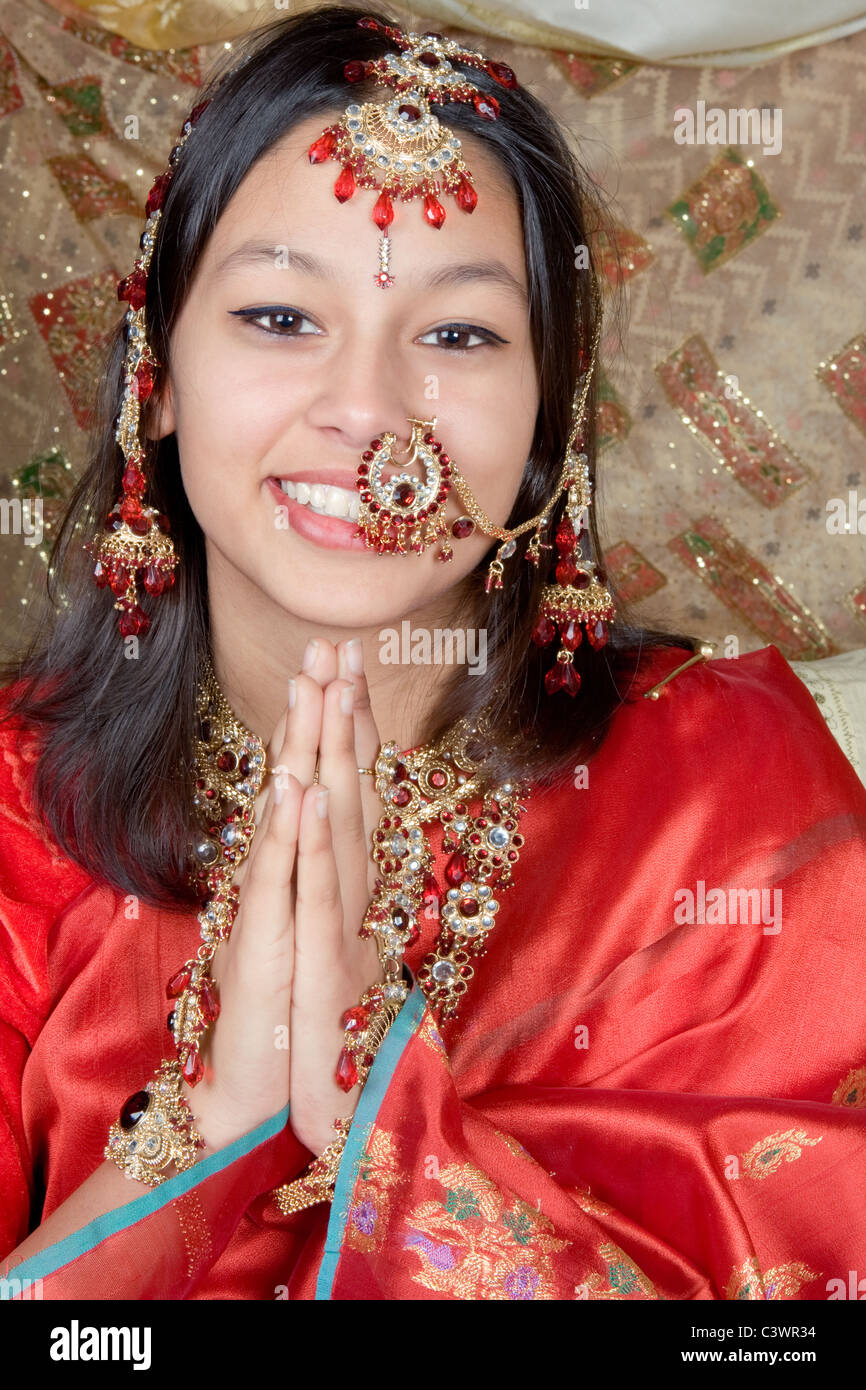 Young Indian beauty giving the Namaste greeting from India Stock Photo ...