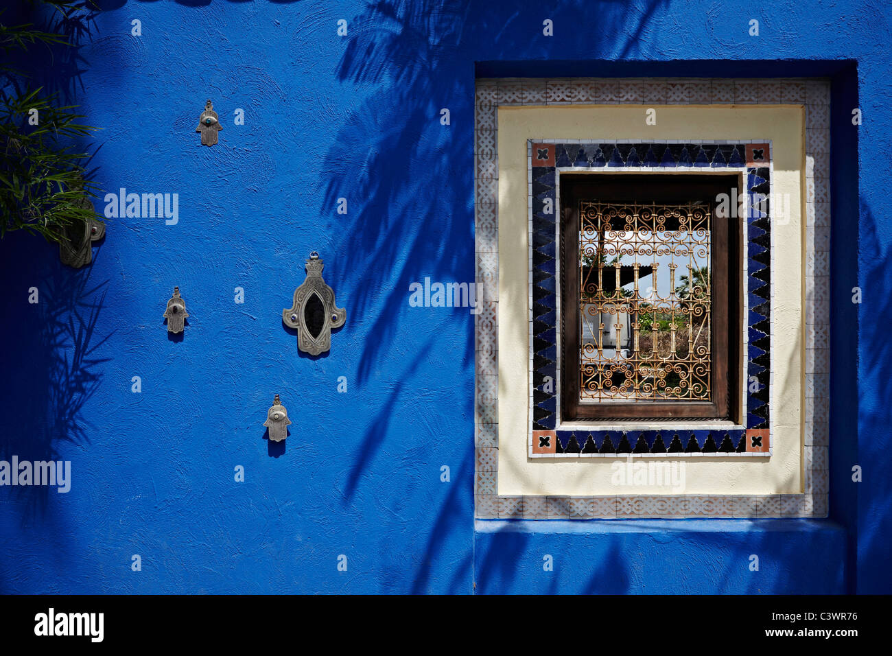 Blue paint house. Moroccan style house with vivid blue wall exterior ...