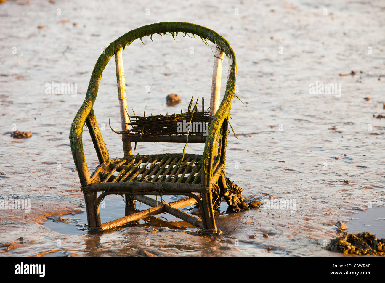 A chair thrown into mud on the river Tees in Middlesbrough, Teeside, UK ...