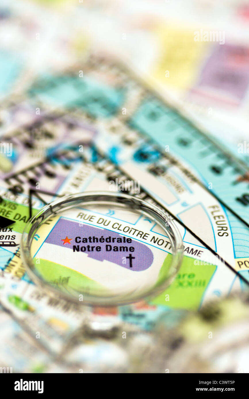 Close up view of a tourist map with a compass magnifying Notre Dame ...