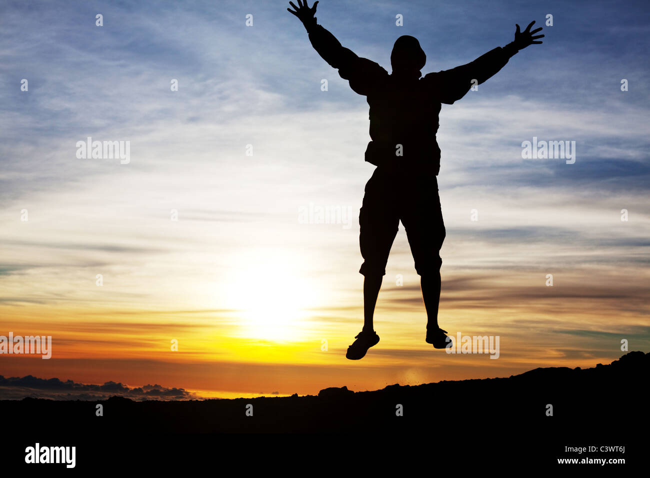 Jumping boy on Haleakala summit, Hawaii Stock Photo - Alamy