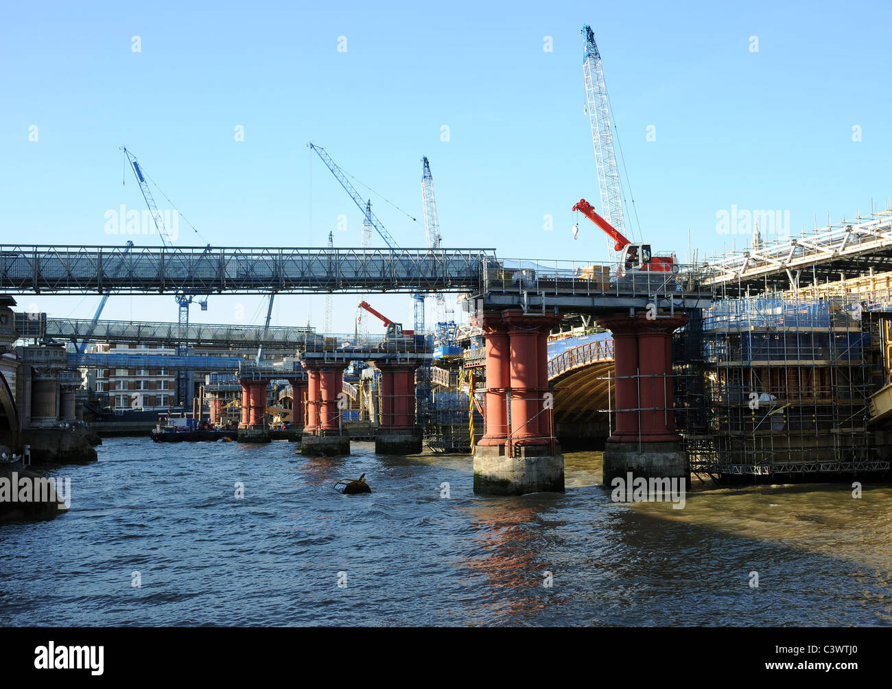 Heavy industrial cranes and scaffolding during the reconstruction and ...