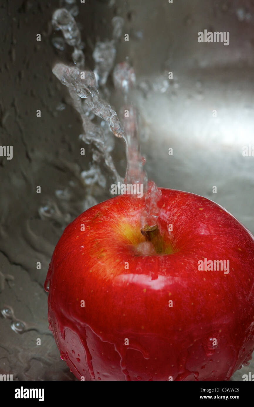 water splashing off a red apple Stock Photo - Alamy