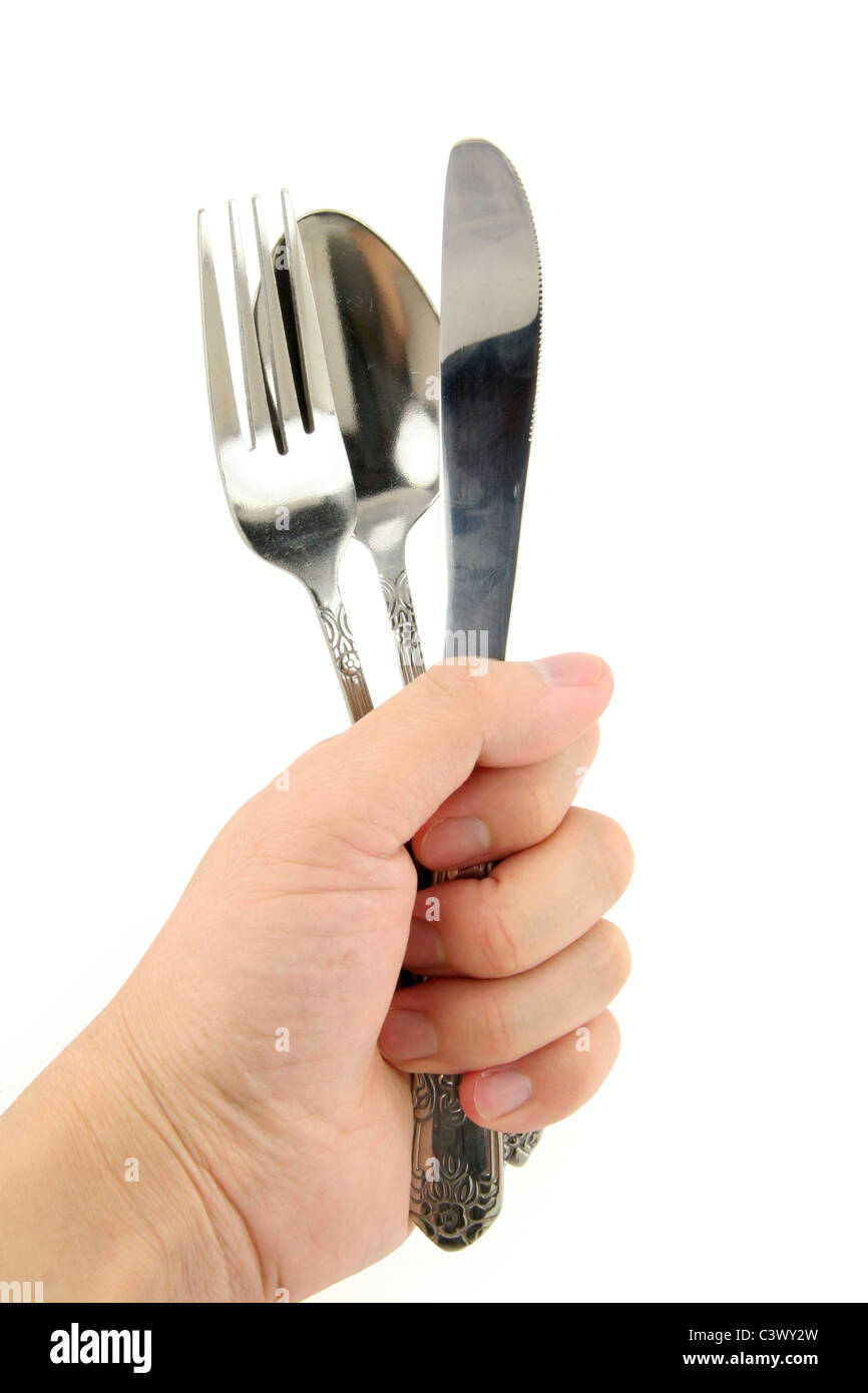 hand holding tableware with white background, concept of hungry Stock ...