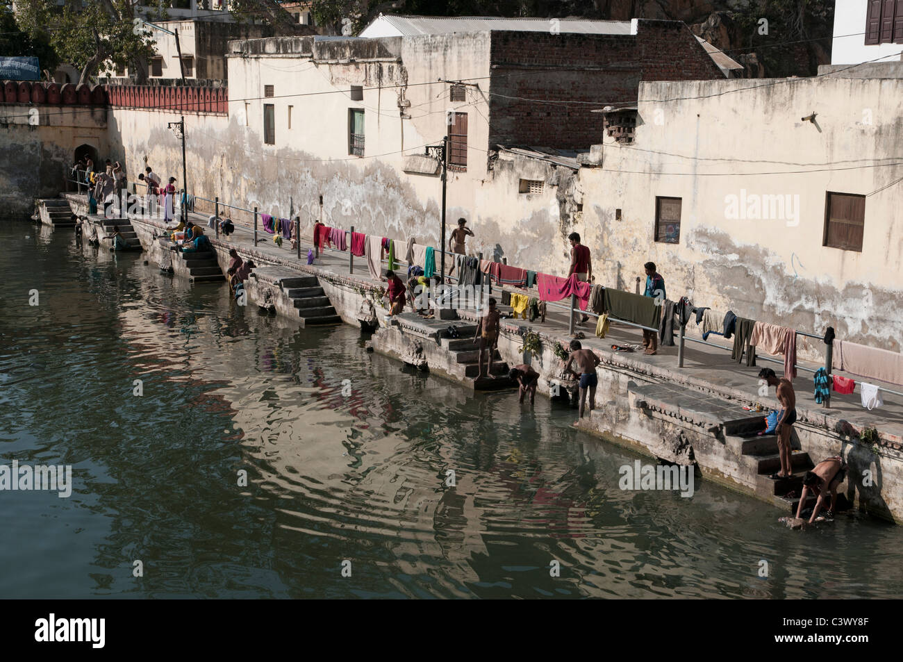 Indian girl washing clothes hi-res stock photography and images - Alamy