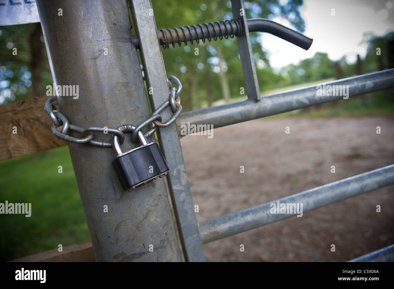 20.5.2011 Padlock on farm gate Stock Photo - Alamy