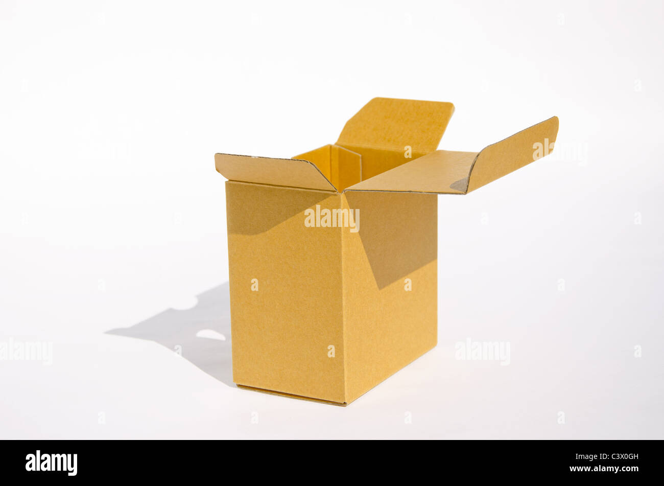 yellow cardboard box isolated on white background Stock Photo - Alamy