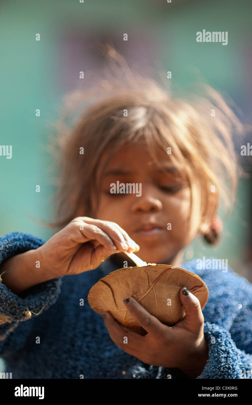 Indian child eating Stock Photo - Alamy