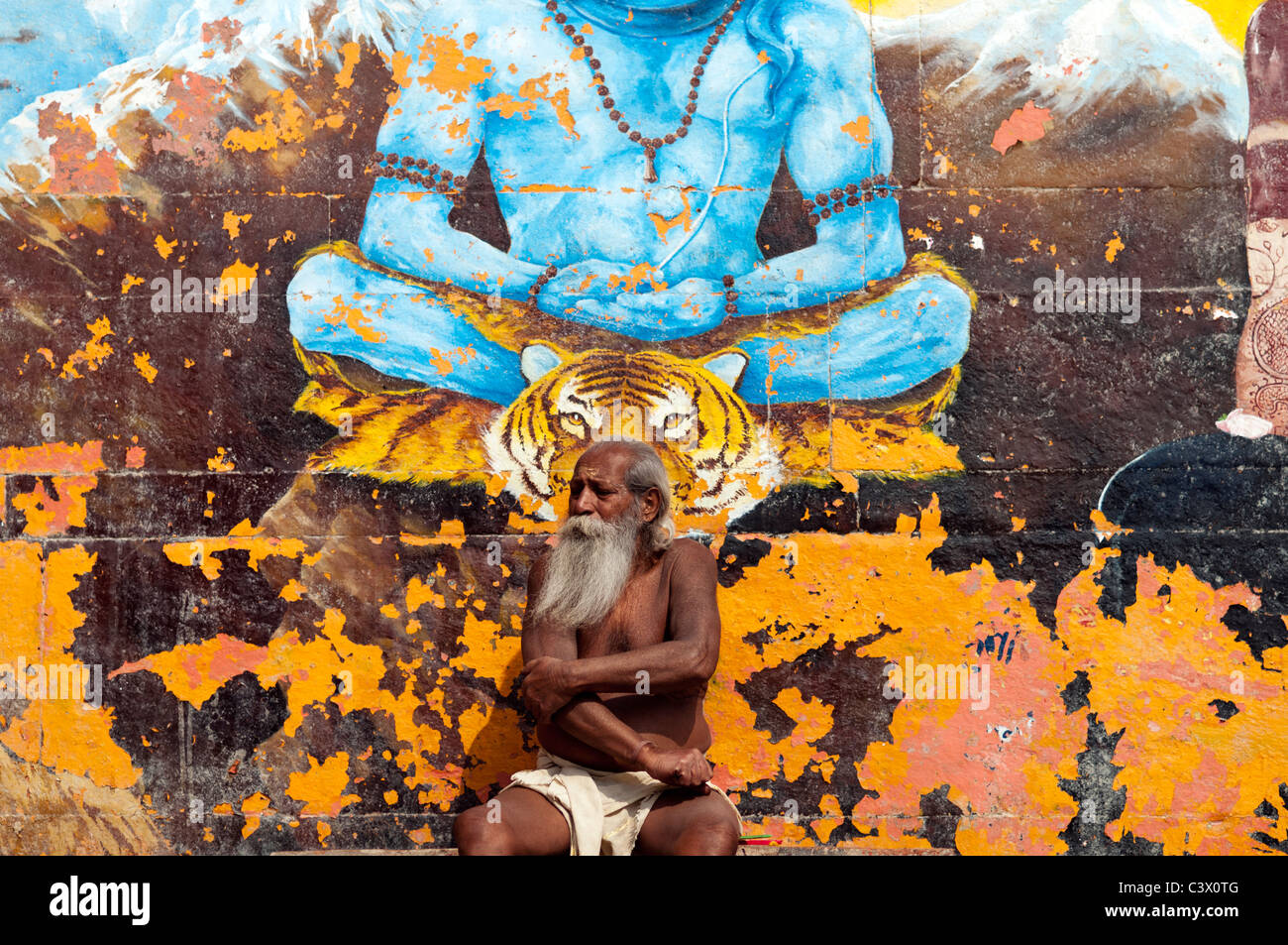Man taking the sun in Varanasi Stock Photo - Alamy
