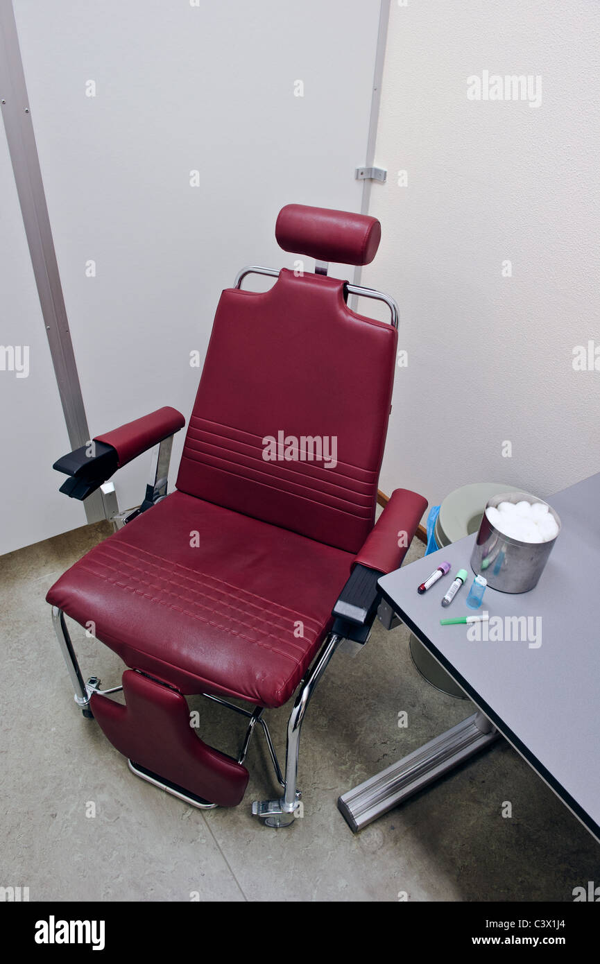 chair in hospital room for taking blood samples with two small tubes ...