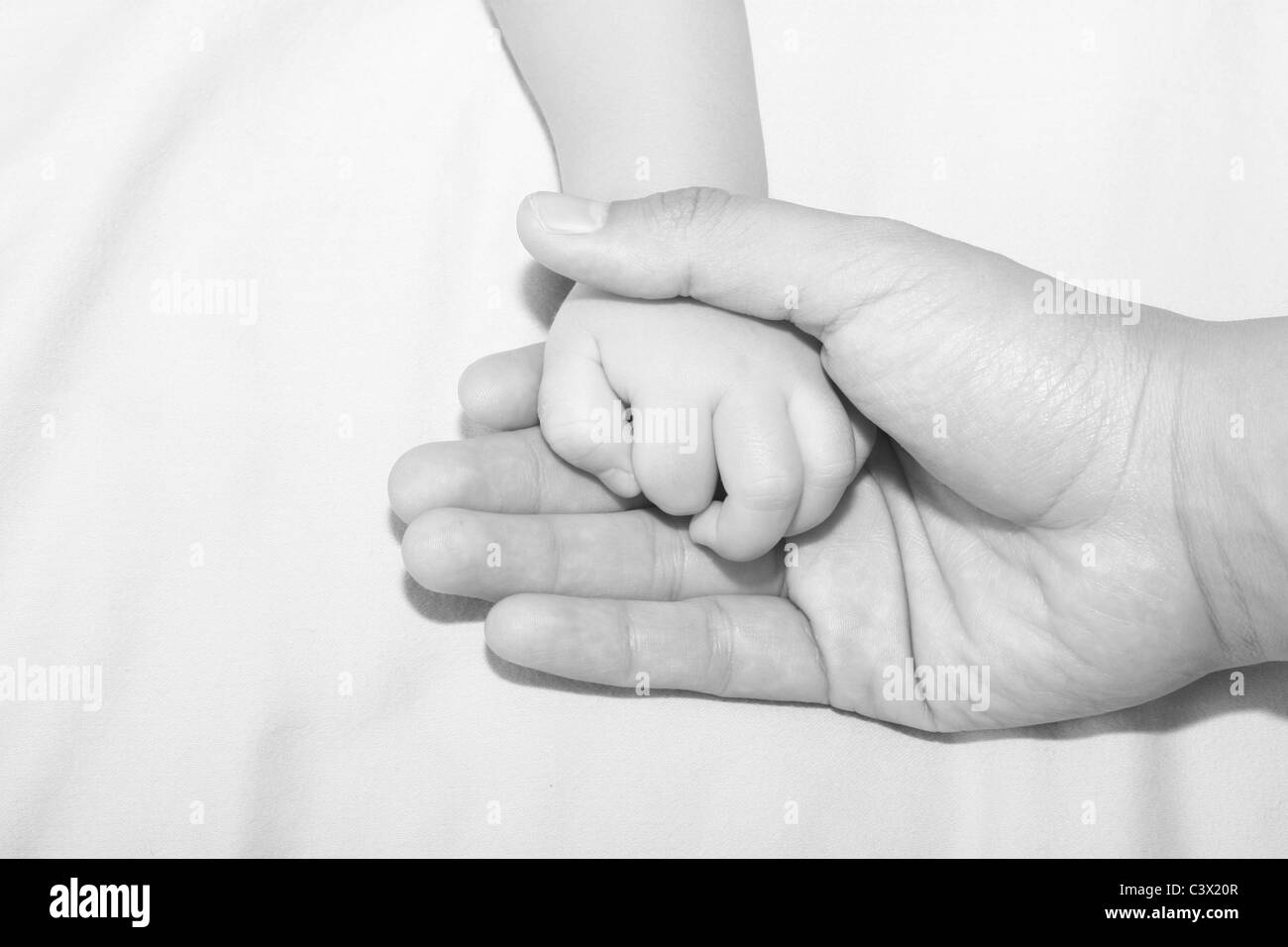 Father holding daughters hand Stock Photo - Alamy