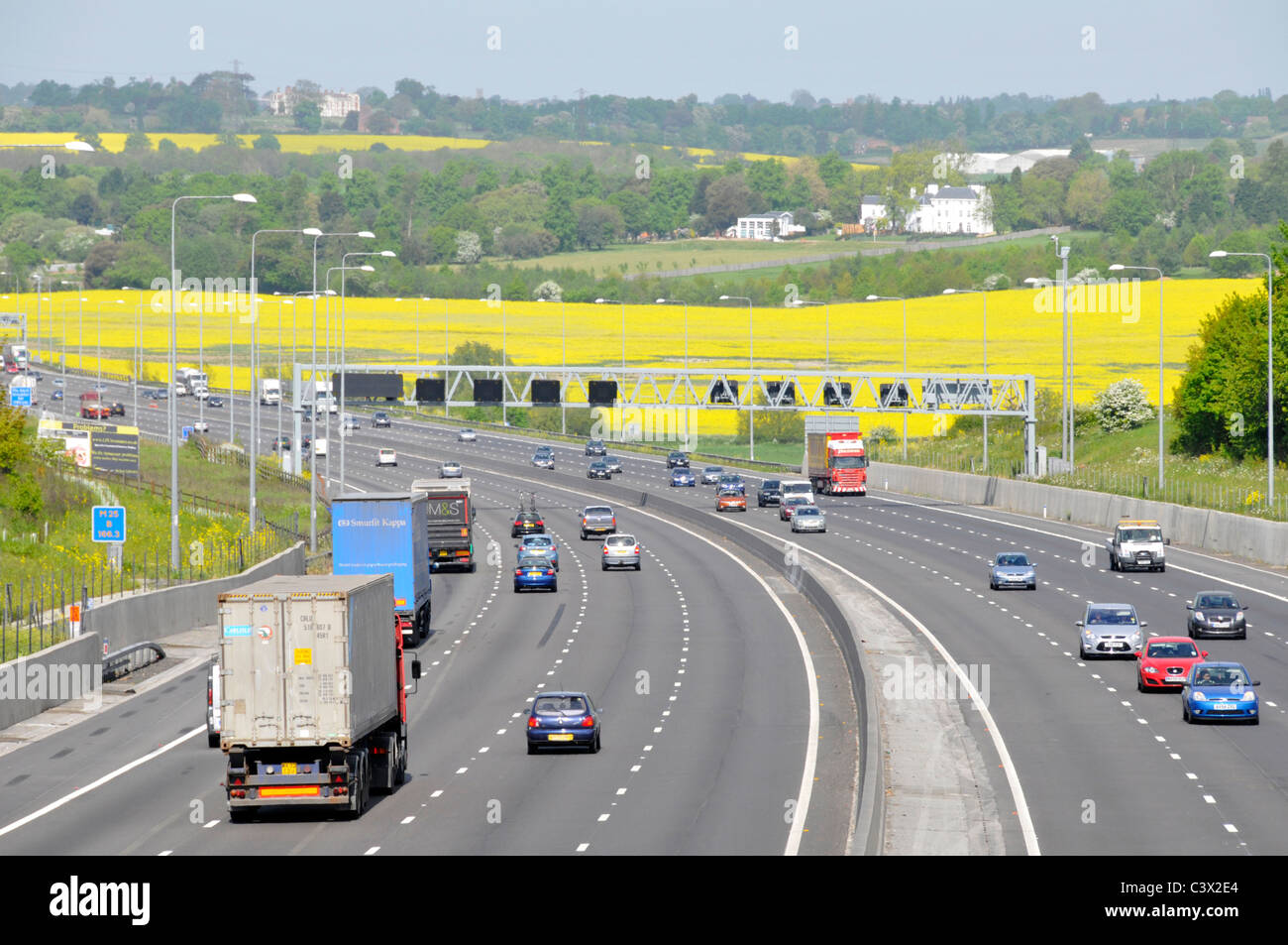 Rural landscape section of the M25 motorway in Essex widened to 8 lanes ...