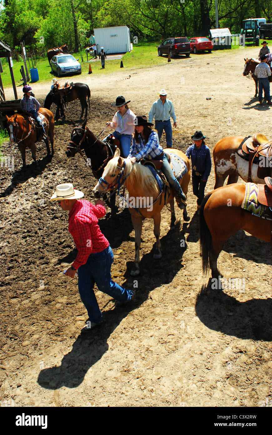 Teenage rodeo competitors assemble outside of arena Stock Photo - Alamy