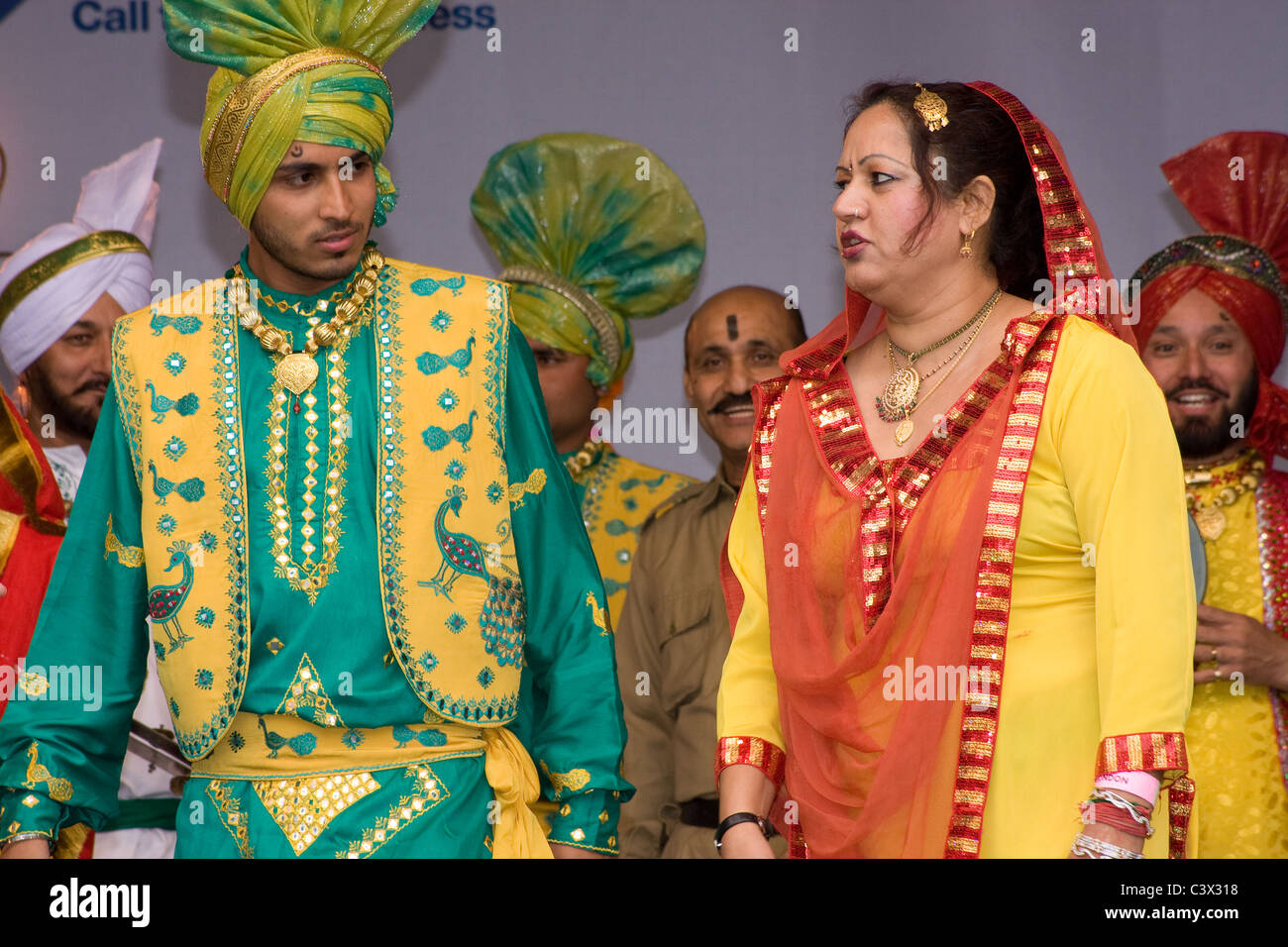 Sikh Indian dancers in traditional dress costume Stock Photo - Alamy
