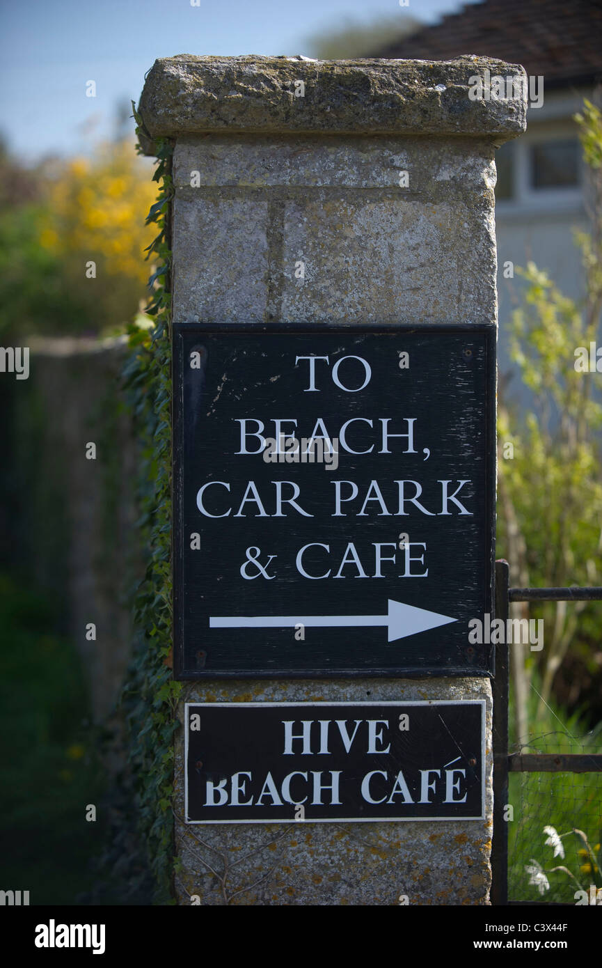 The sign to Hive Beach and Cafe, in Burton Bradstock, Dorset Stock ...