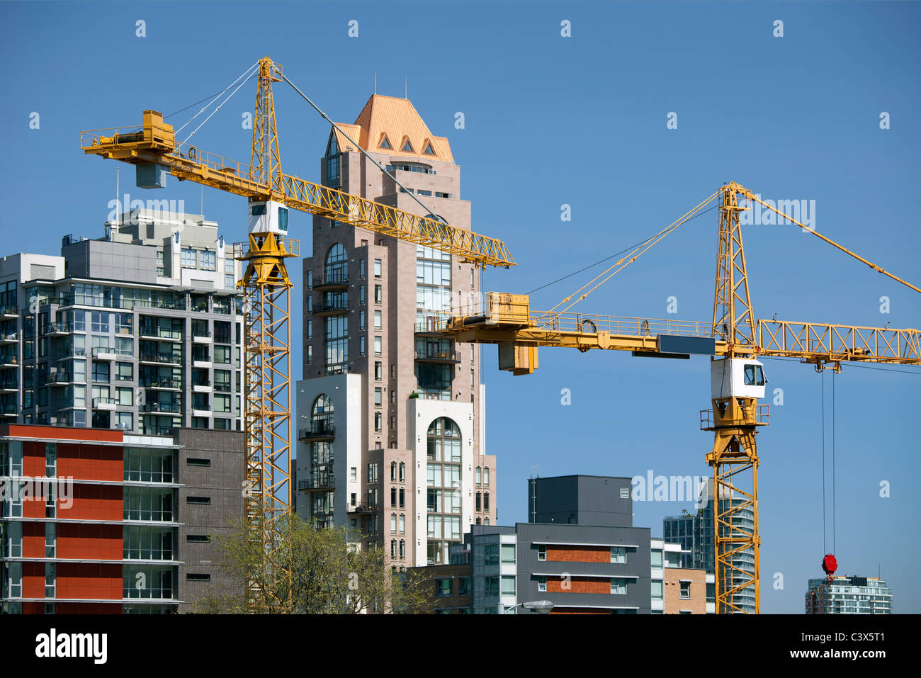 Two cranes at construction site in Vancouver Stock Photo - Alamy