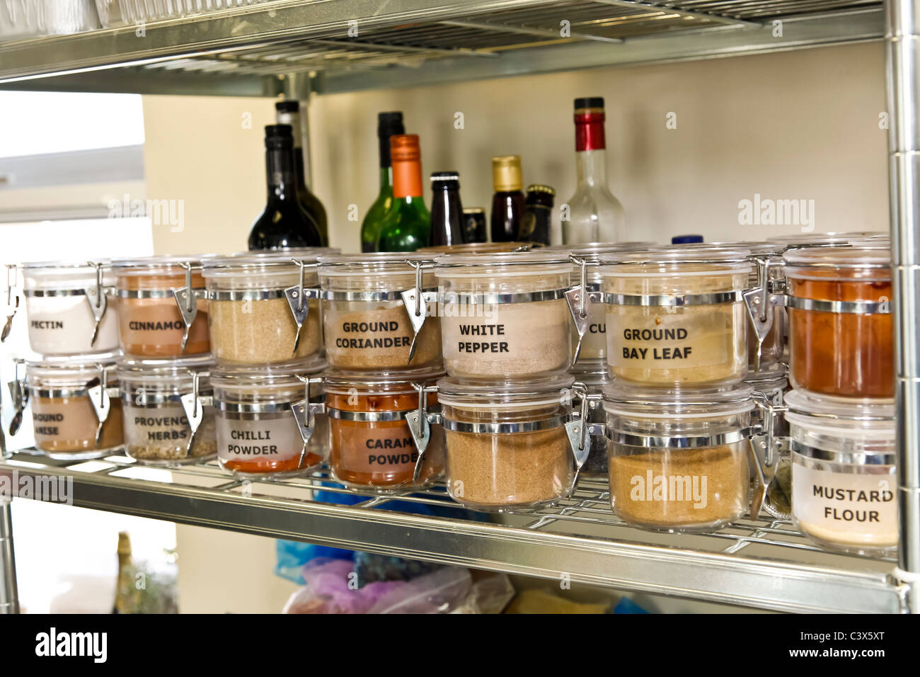 A selection of spices and ingredients on a kitchen rack Stock Photo - Alamy