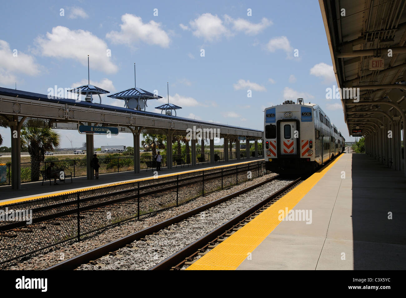 Tri Rail train painted with palm tree US flag and blue sky on the ...