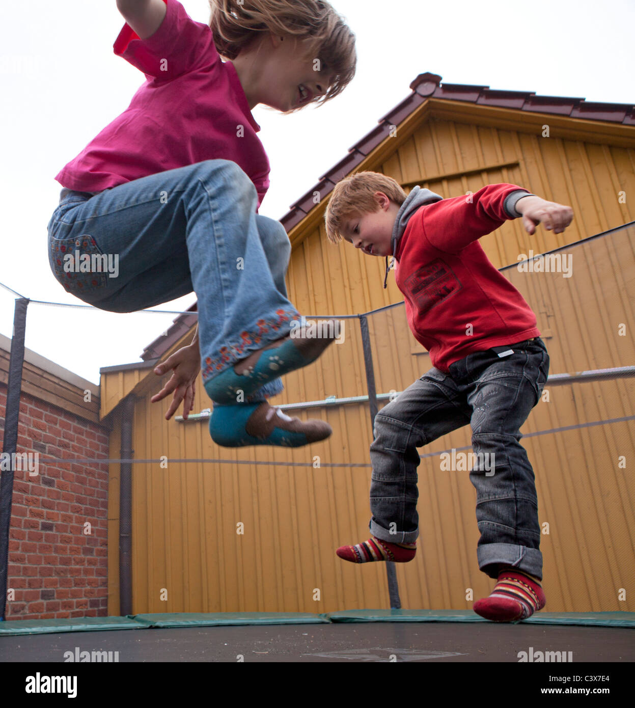 children jumping on a trampoline Stock Photo - Alamy