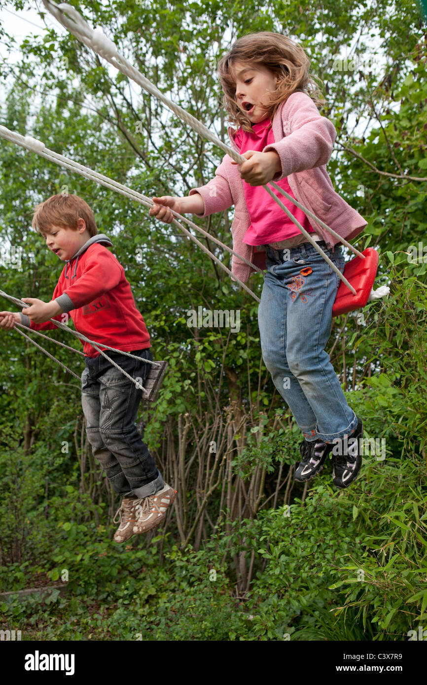 children on a swing Stock Photo - Alamy