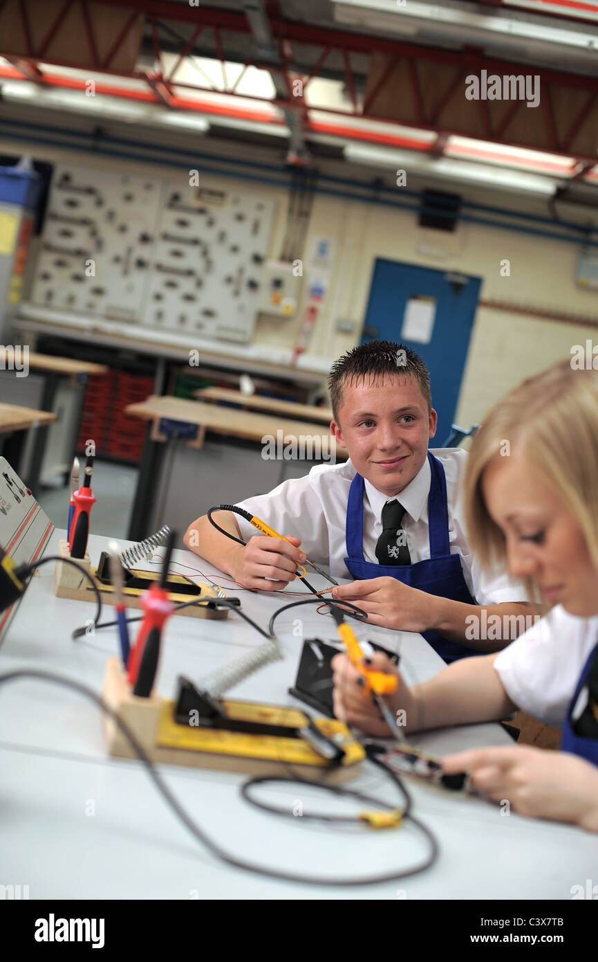 a school girl and boy in a design technology lesson GCSE in a classroom ...