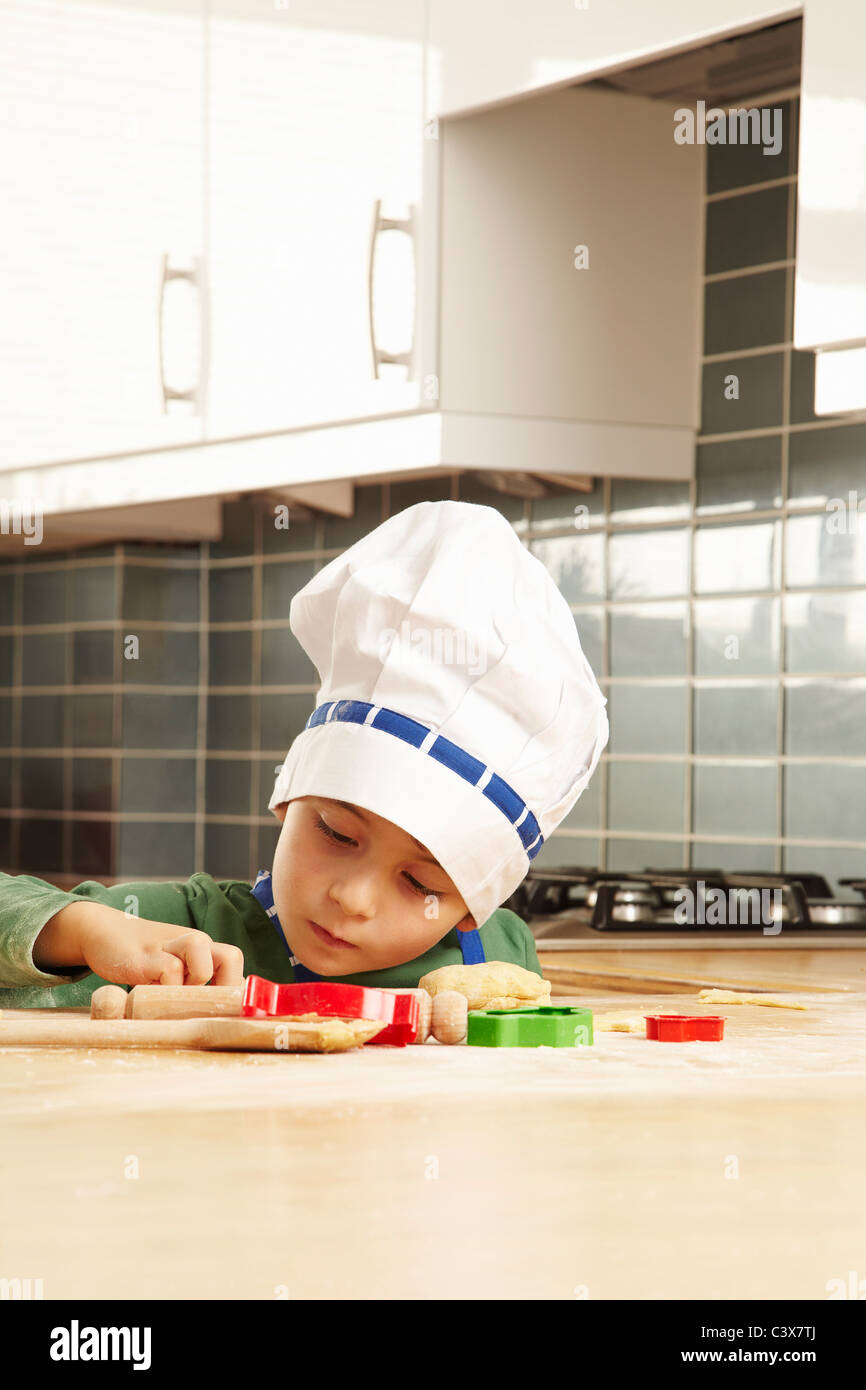 Young boy cooking in kitchen Stock Photo - Alamy