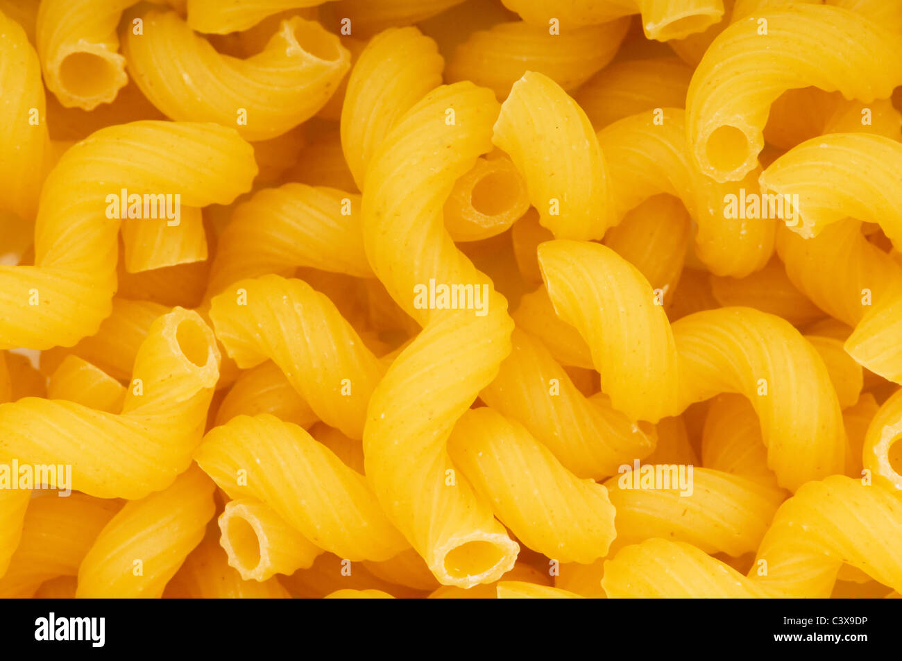 Close up of italian pasta - spiral shaped Stock Photo - Alamy