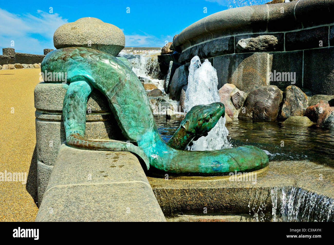 One of several bronze sculptures of a snake around the basin of the ...