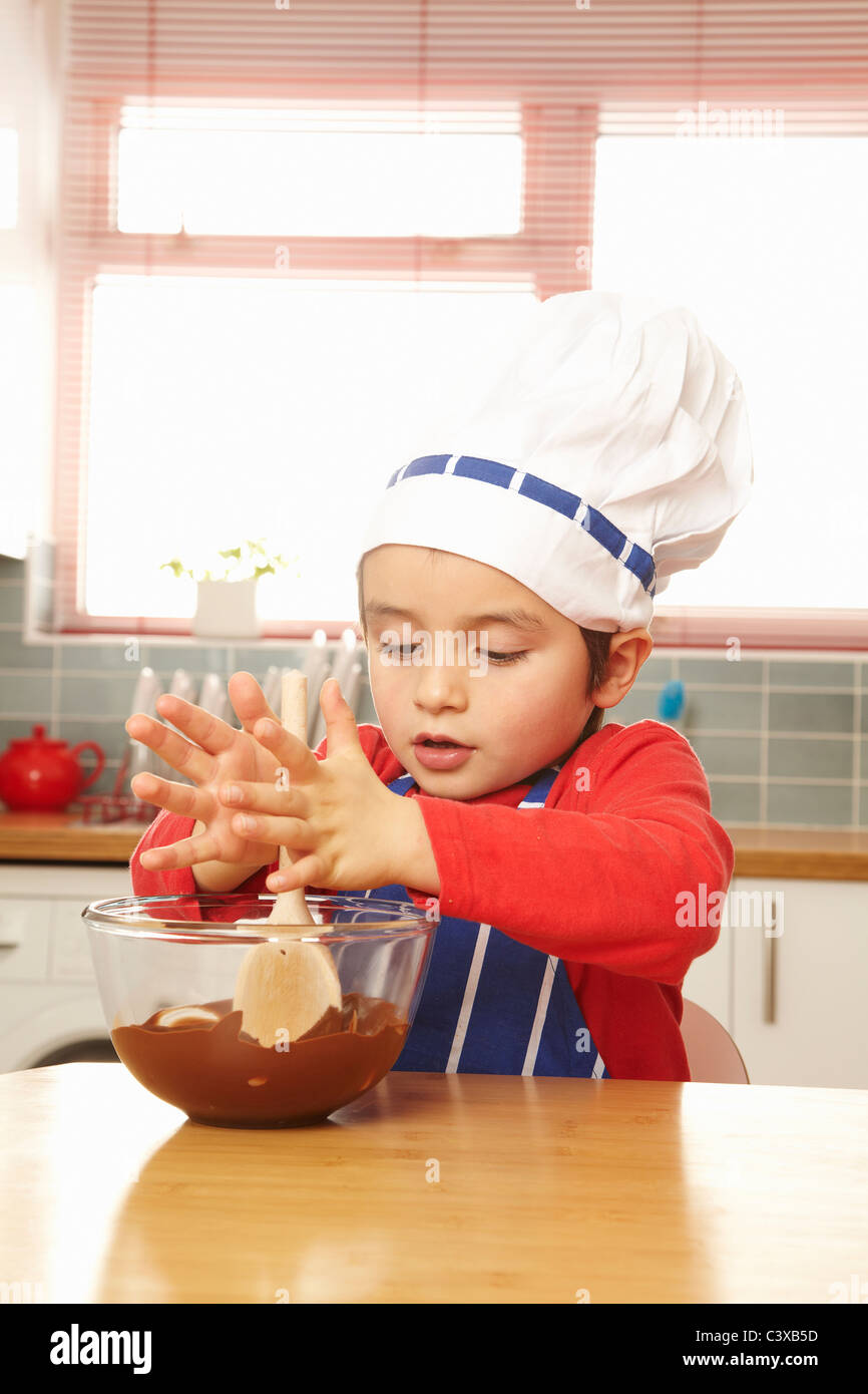 Child wooden spoon stirring hi-res stock photography and images - Alamy