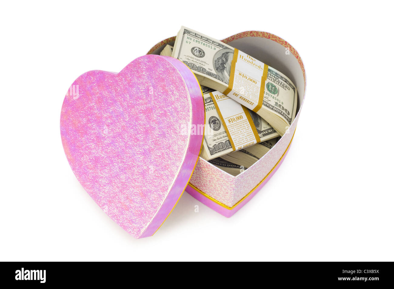 Heart shaped gift box and dollars inside Stock Photo - Alamy