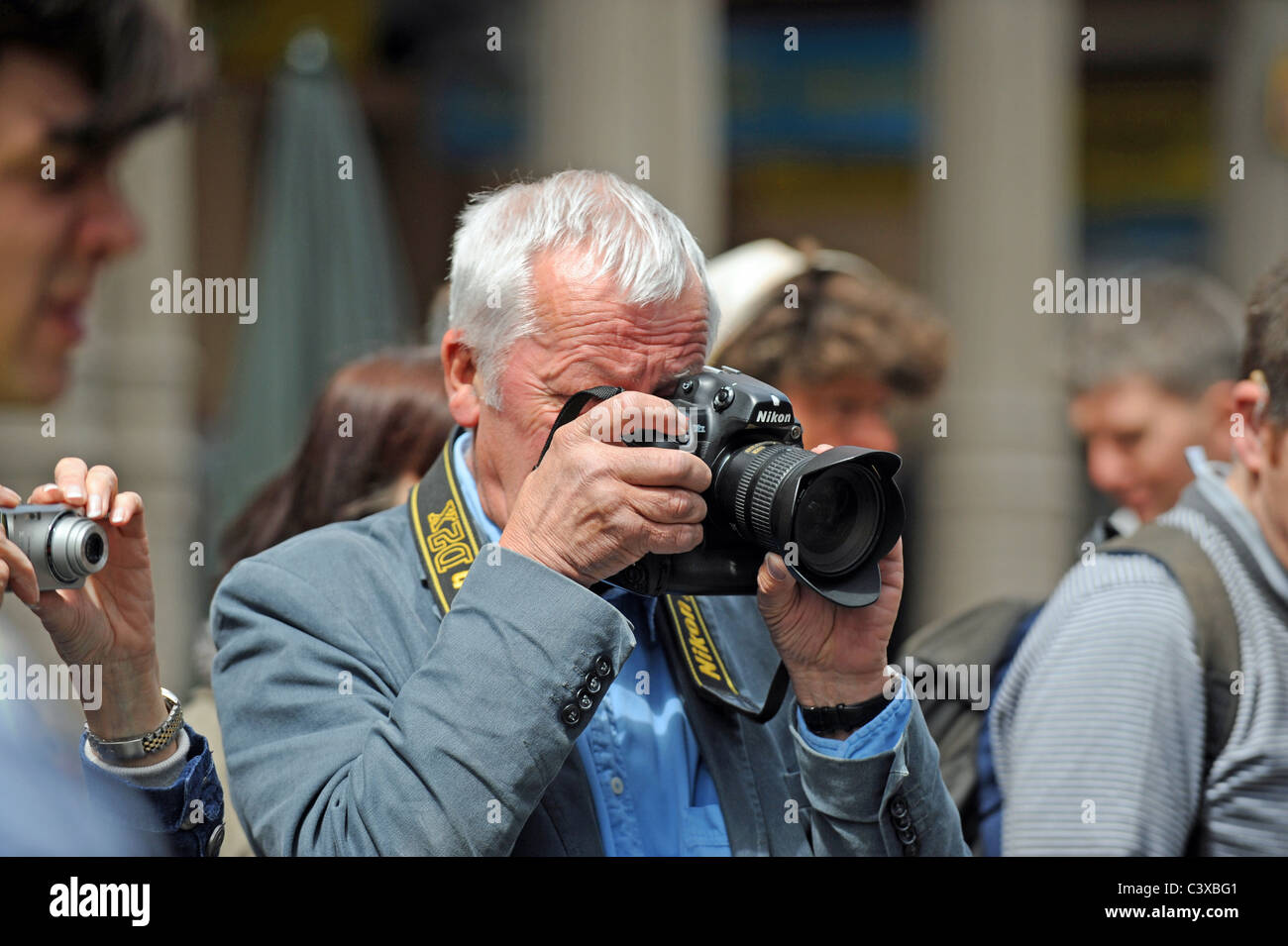 Photographer photojournalist working hi-res stock photography and ...
