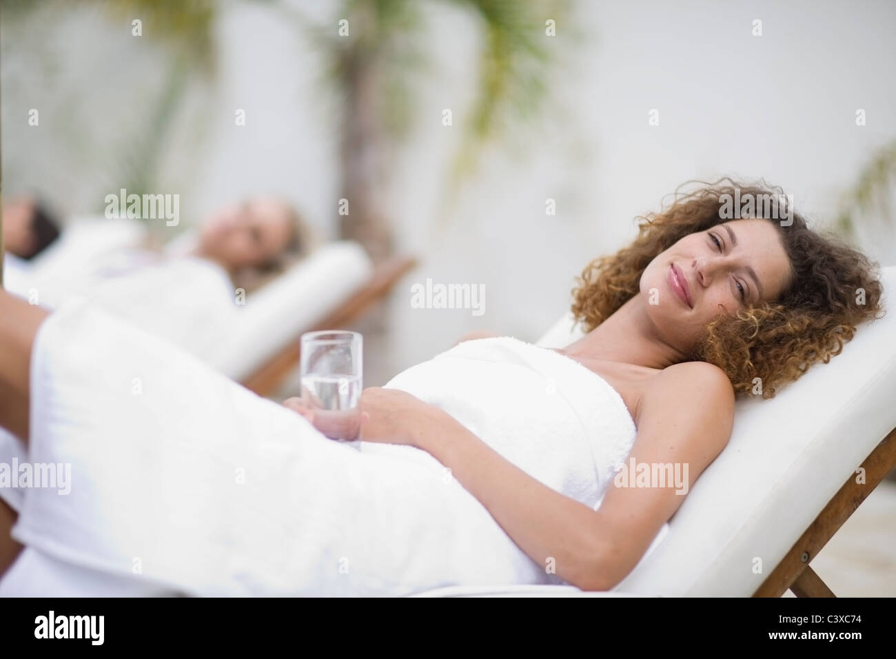 Woman in a spa on deckchair Stock Photo - Alamy