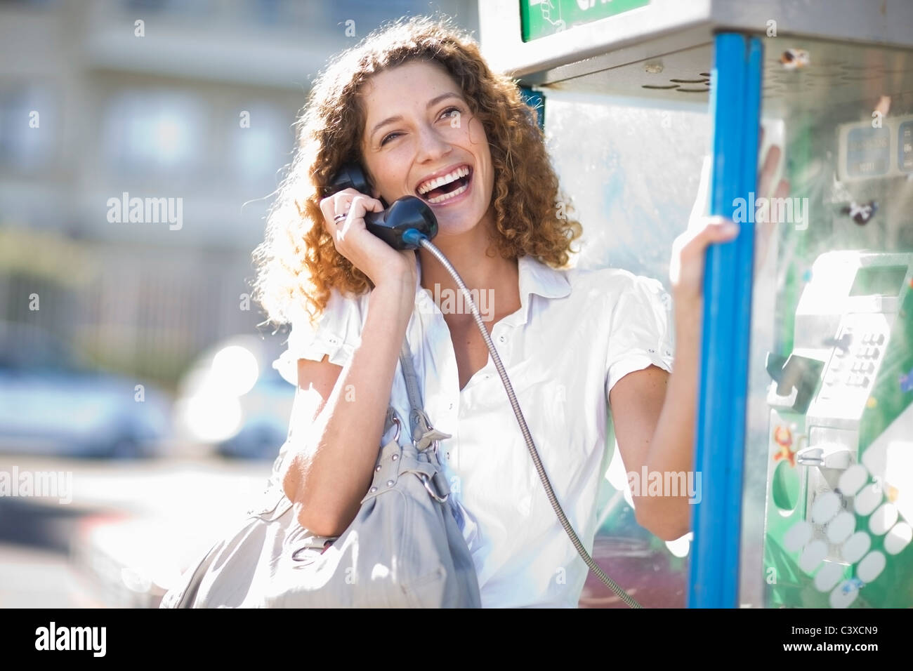 Woman ringing a friend Stock Photo - Alamy