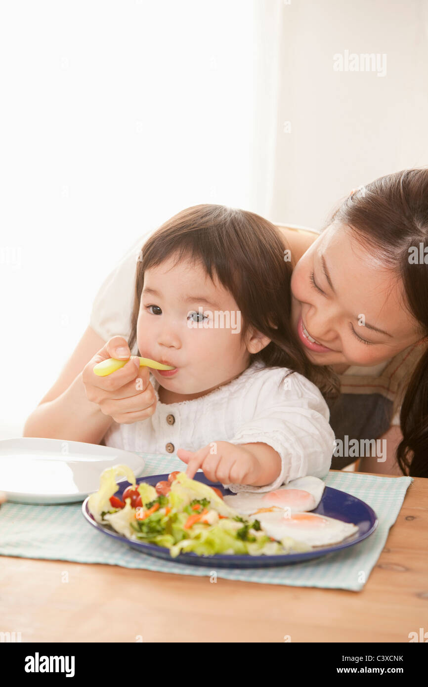 Mother feeding the young one hi-res stock photography and images - Alamy