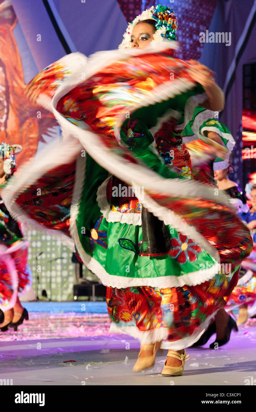 A dancer swirls her dress on stage at the santa cruz de tenerife ...