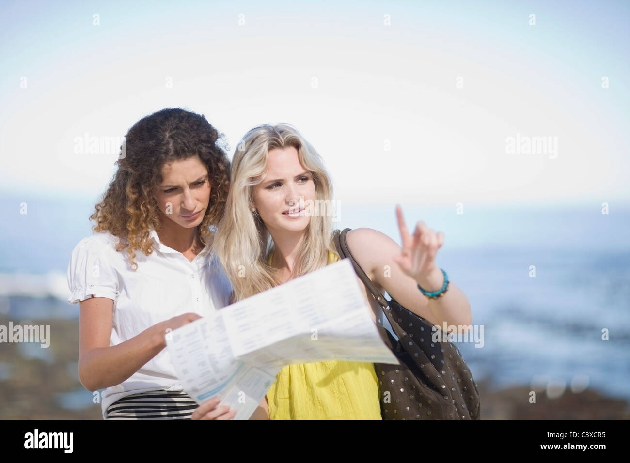 Women planning route map hi-res stock photography and images - Alamy