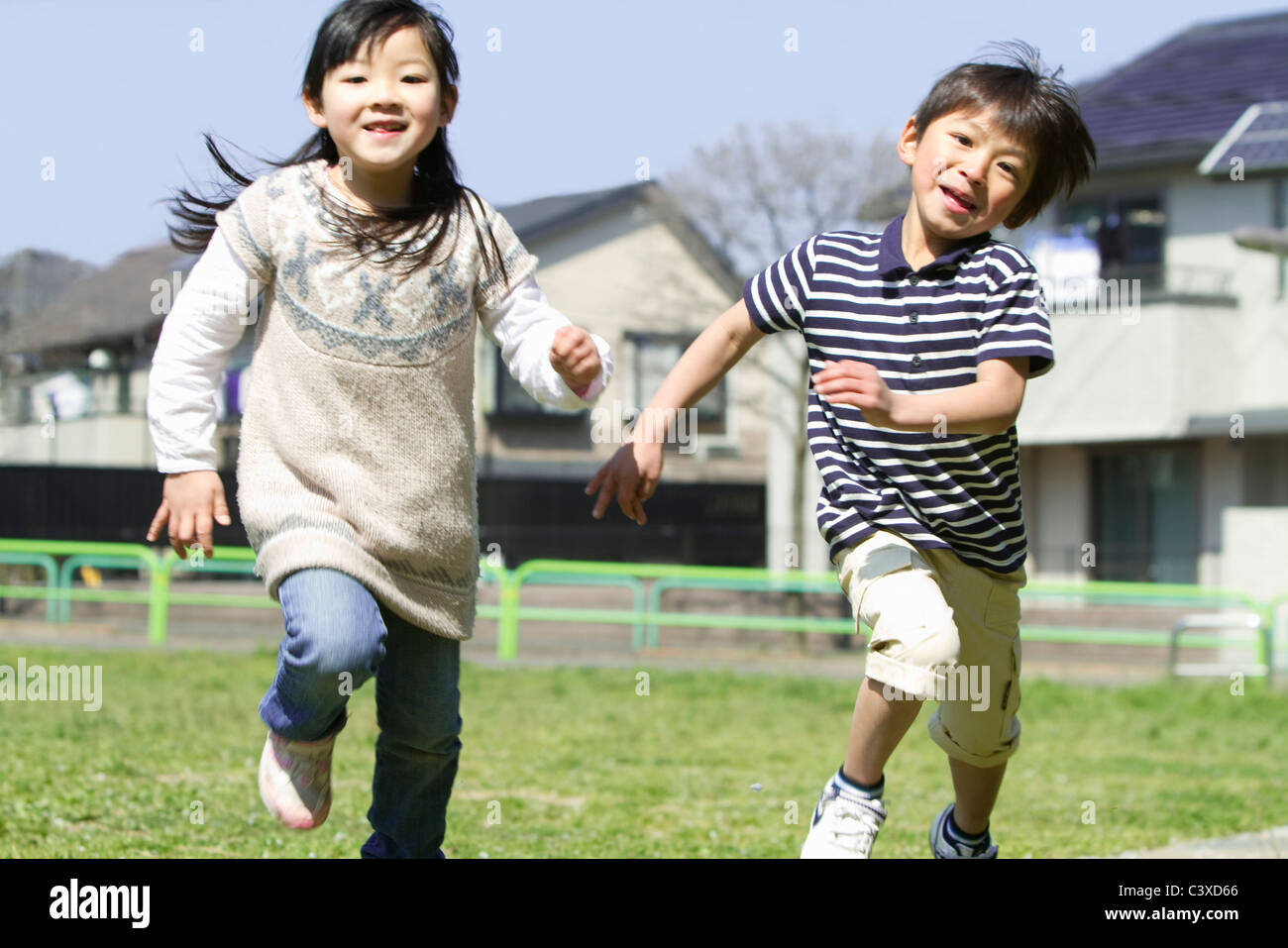 Sister and Brother Running Stock Photo - Alamy